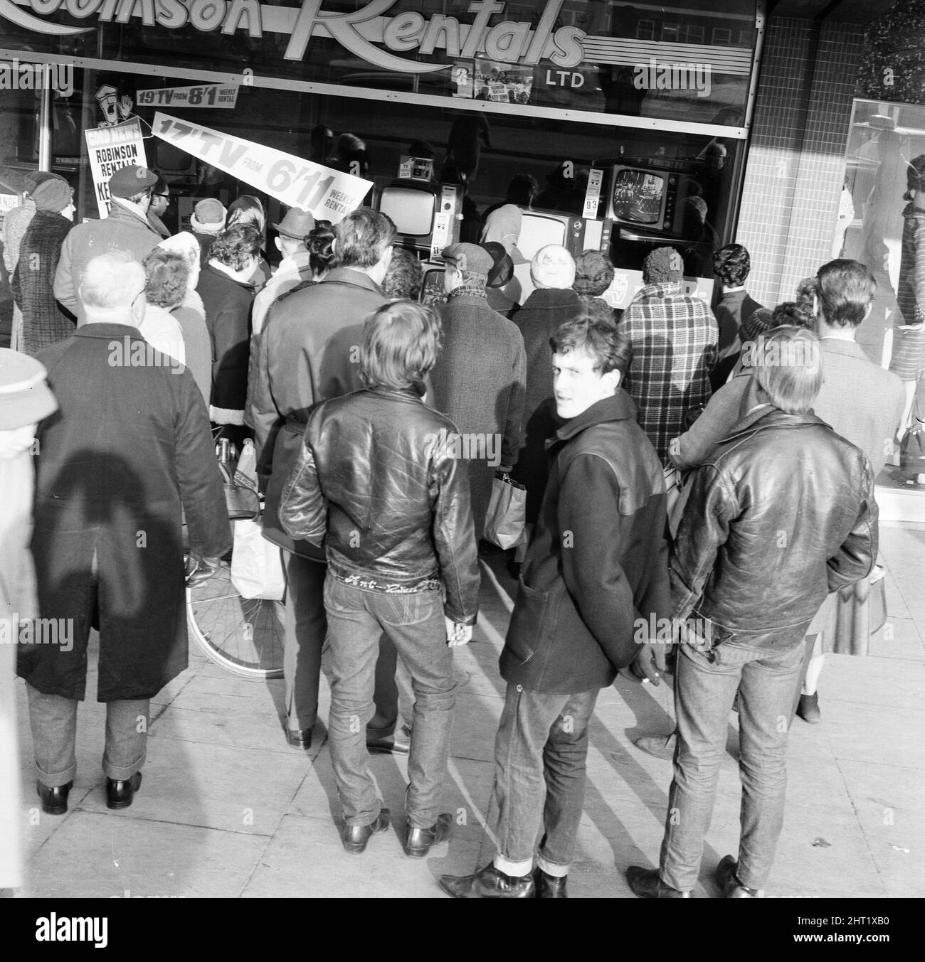 Shoppers watch Sir Winston Churchill state funeral through shop window ...