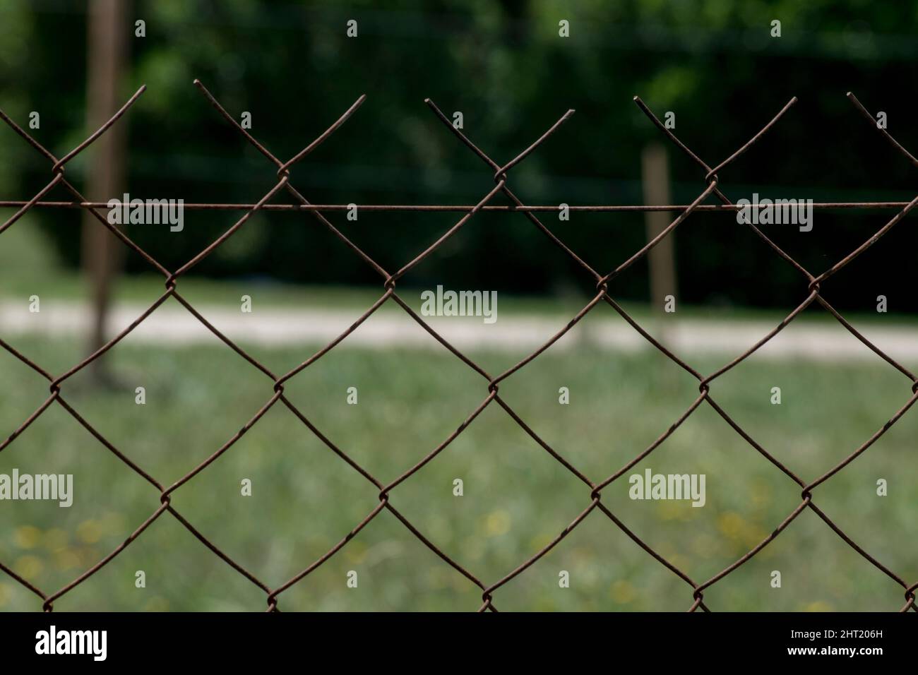 close-up of a fence to divide two pieces of land Stock Photo - Alamy
