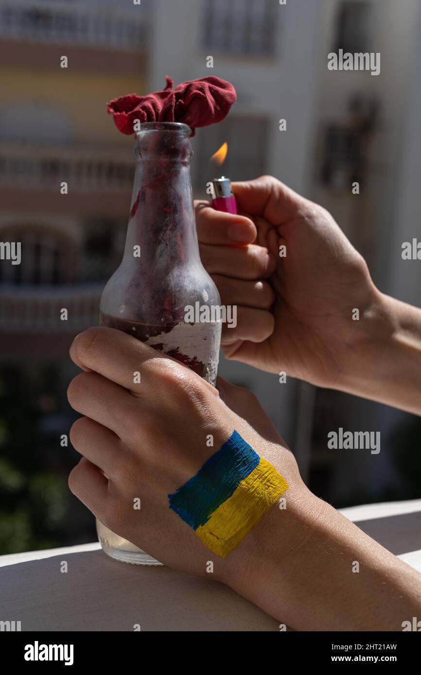 female with lighter ignite molotov cocktail Stock Photo - Alamy