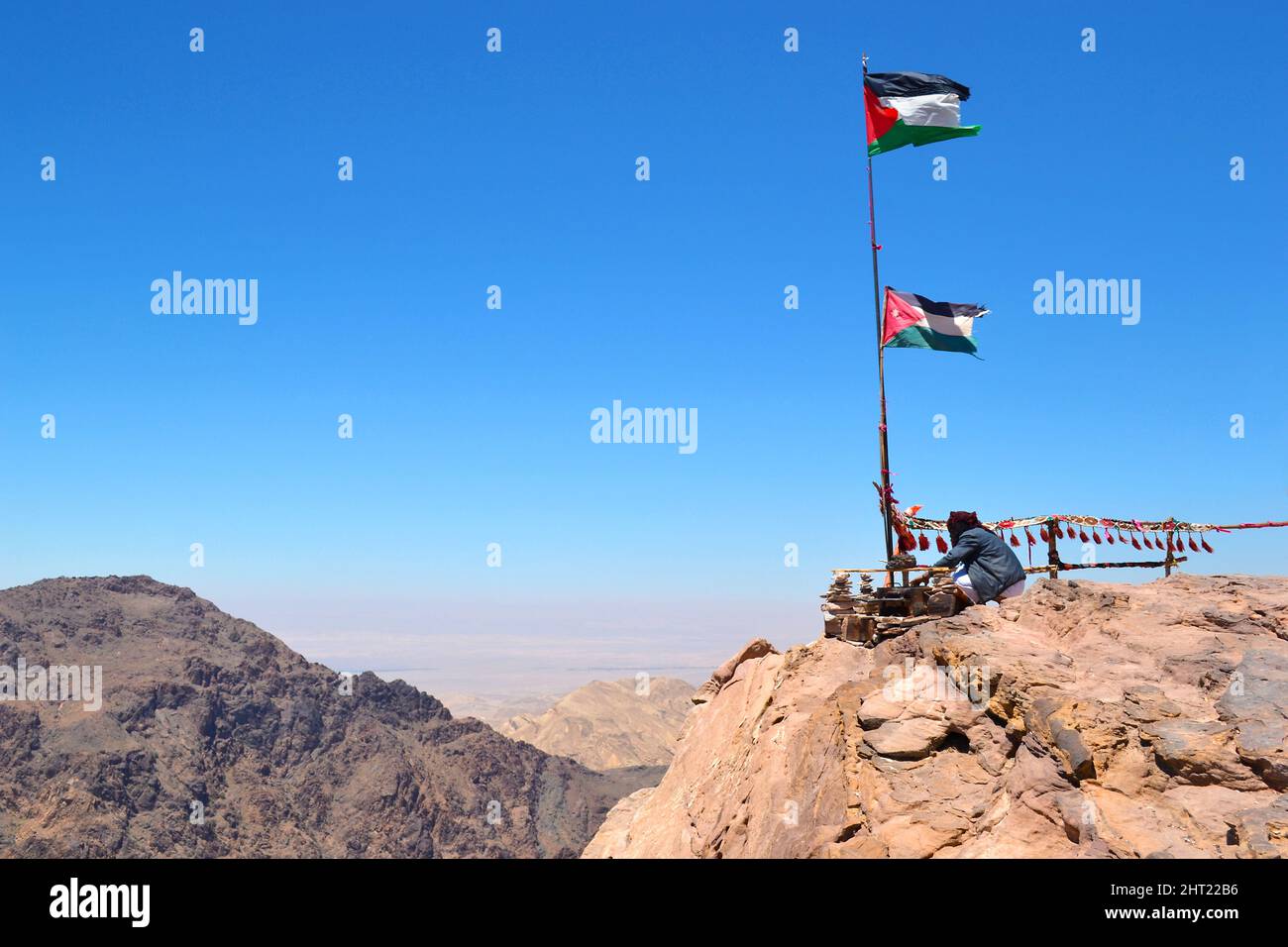 Bedouin on top of the mountain, flags be wind, landscape view, Petra ...