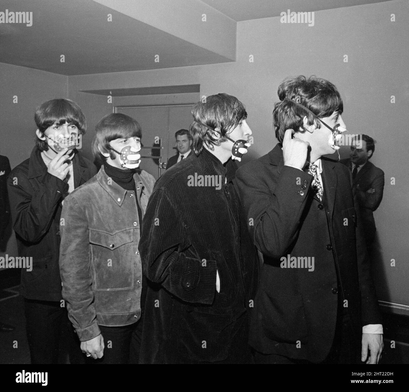 The Beatles with smog masks on before playing at the Ardwick Theare ...