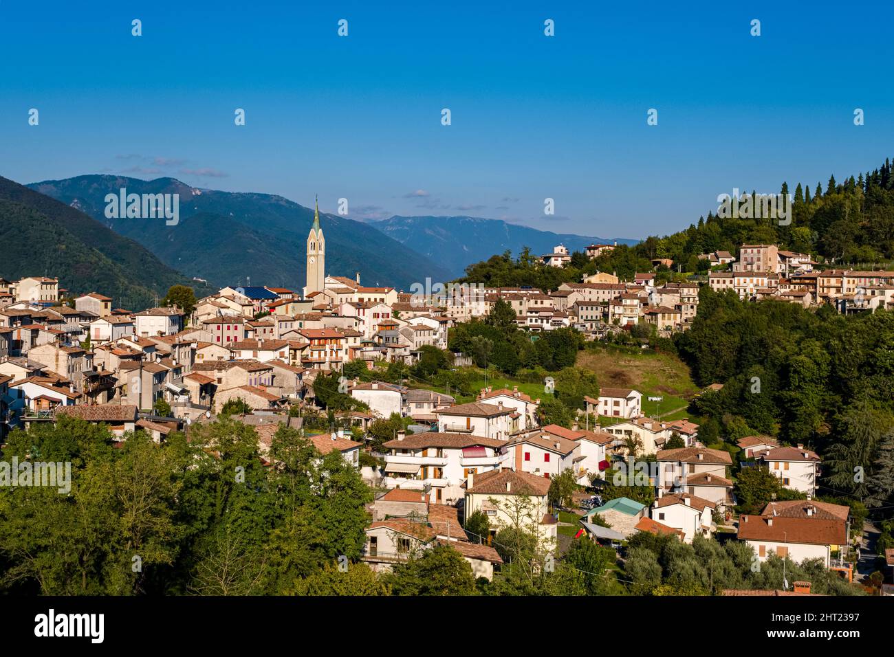 The village Combai with the church Chiesa Parrocchiale di Santo Stefano ...