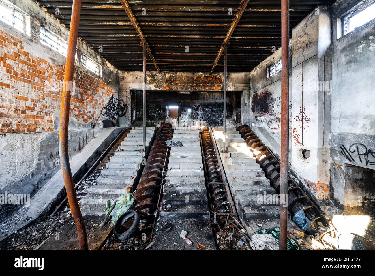 Old abandoned room with a lot of garbage left everywhere on the floor ...