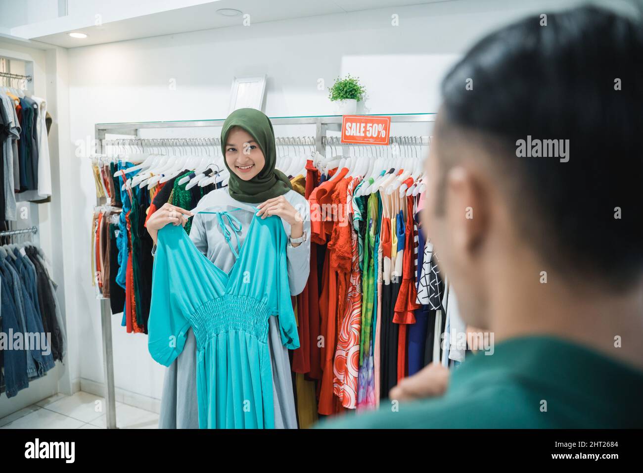 muslim woman asking for advice from husband Stock Photo - Alamy