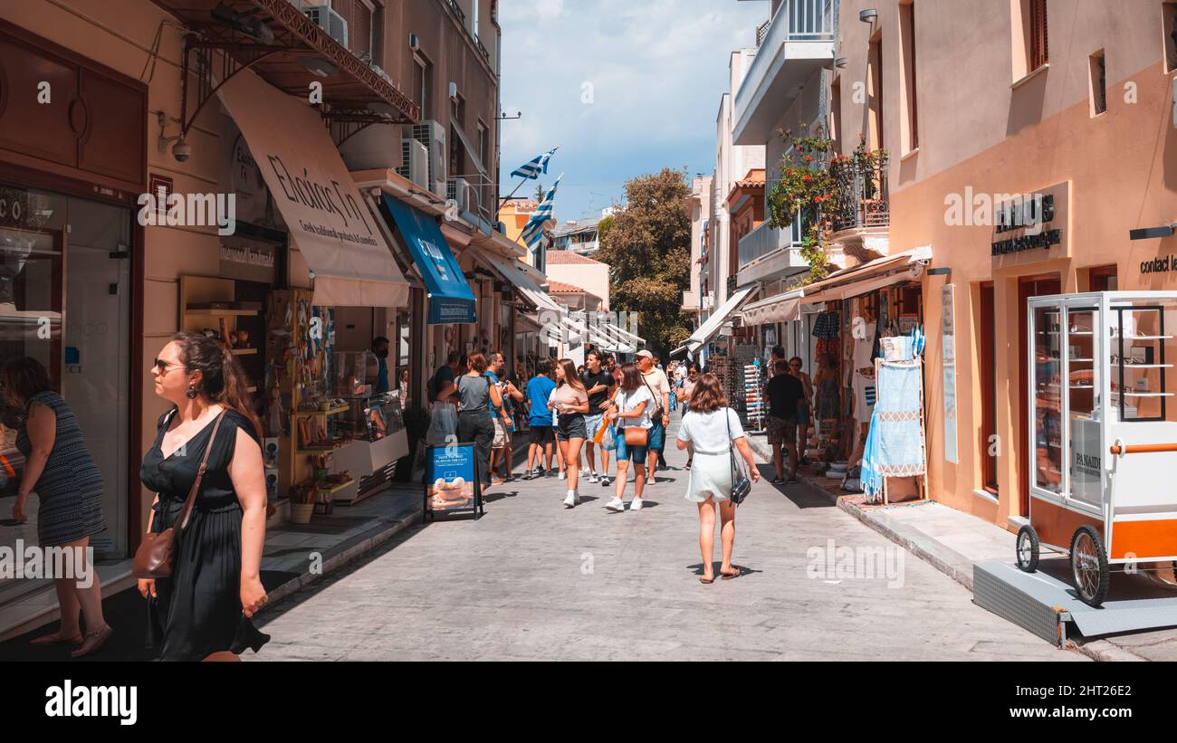 Consumers walk on main commercial street of Athens during the summer ...