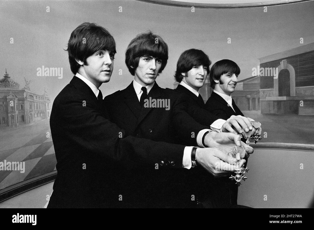 The Beatles show off their MBE medals after the royal investiture at ...