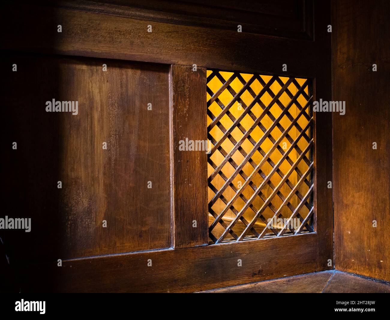 Closeup of a wooden window of the confessional box at church Stock ...
