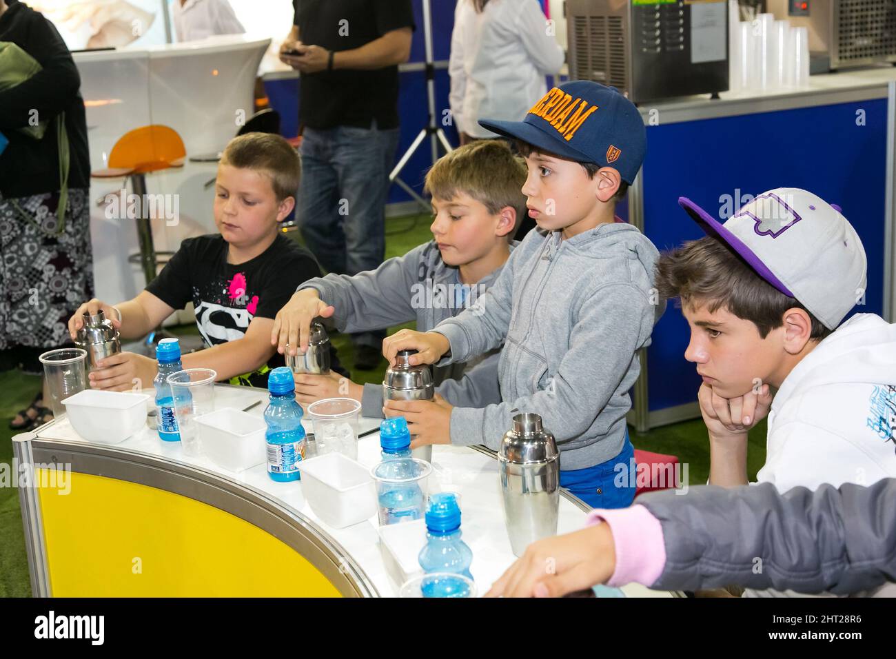 Kids interacting with exhibitors at Food and Wine Expo Stock Photo - Alamy
