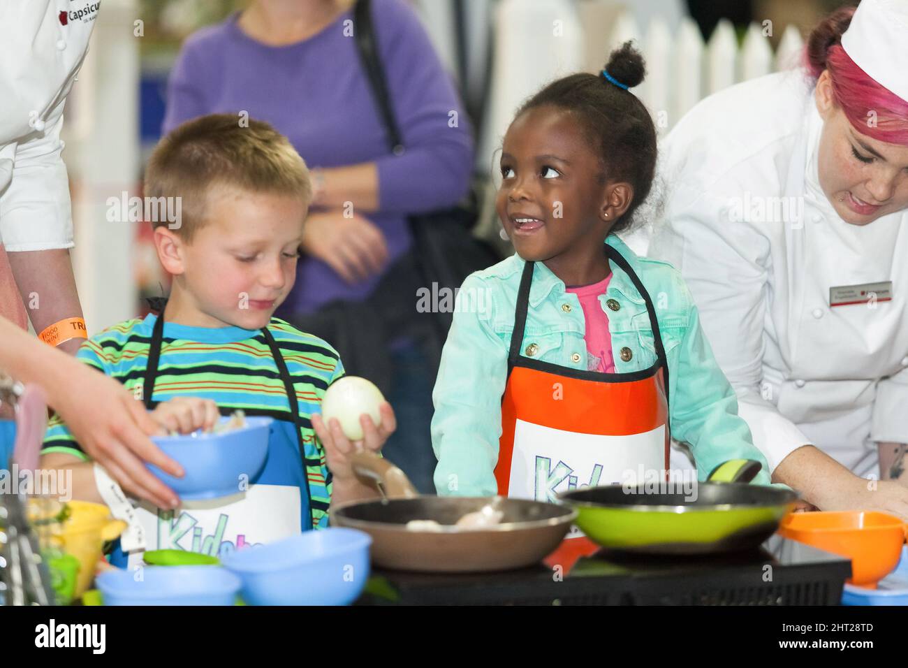 Kids interacting with exhibitors at Food and Wine Expo Stock Photo - Alamy