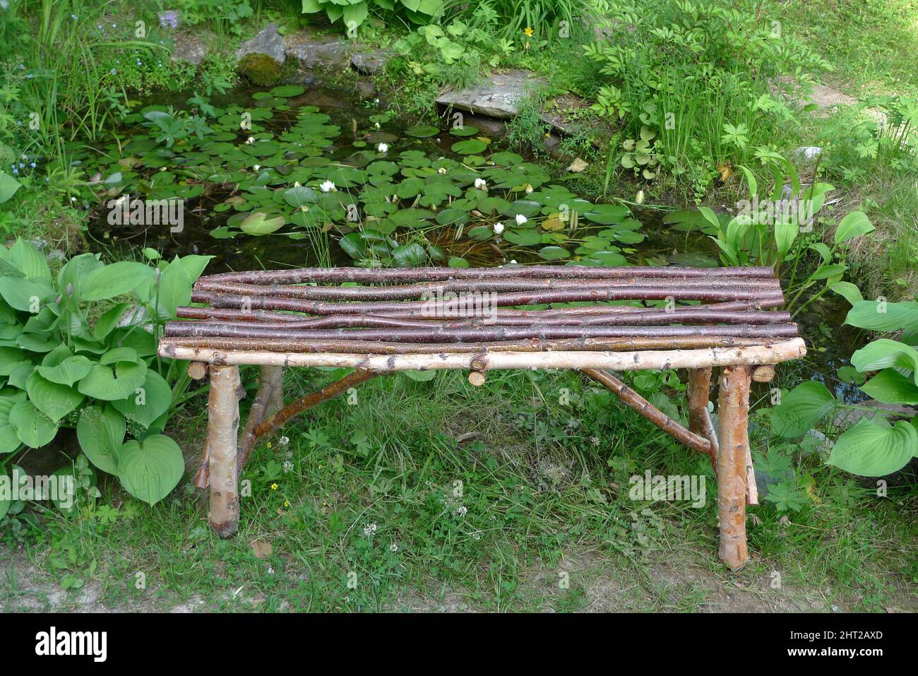 Garden bench in birch Stock Photo - Alamy