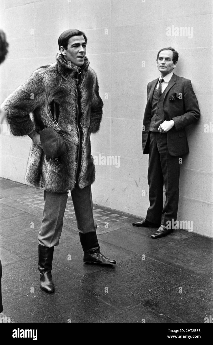 Pierre Cardin pictured with a model displaying one of his men's fashion ...