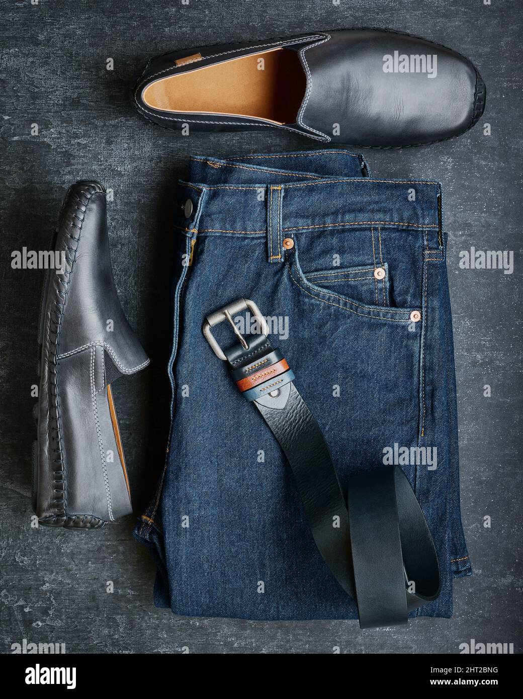 Flat lay mens jeans, moccasins and leather belt, mens fashion, top view ...