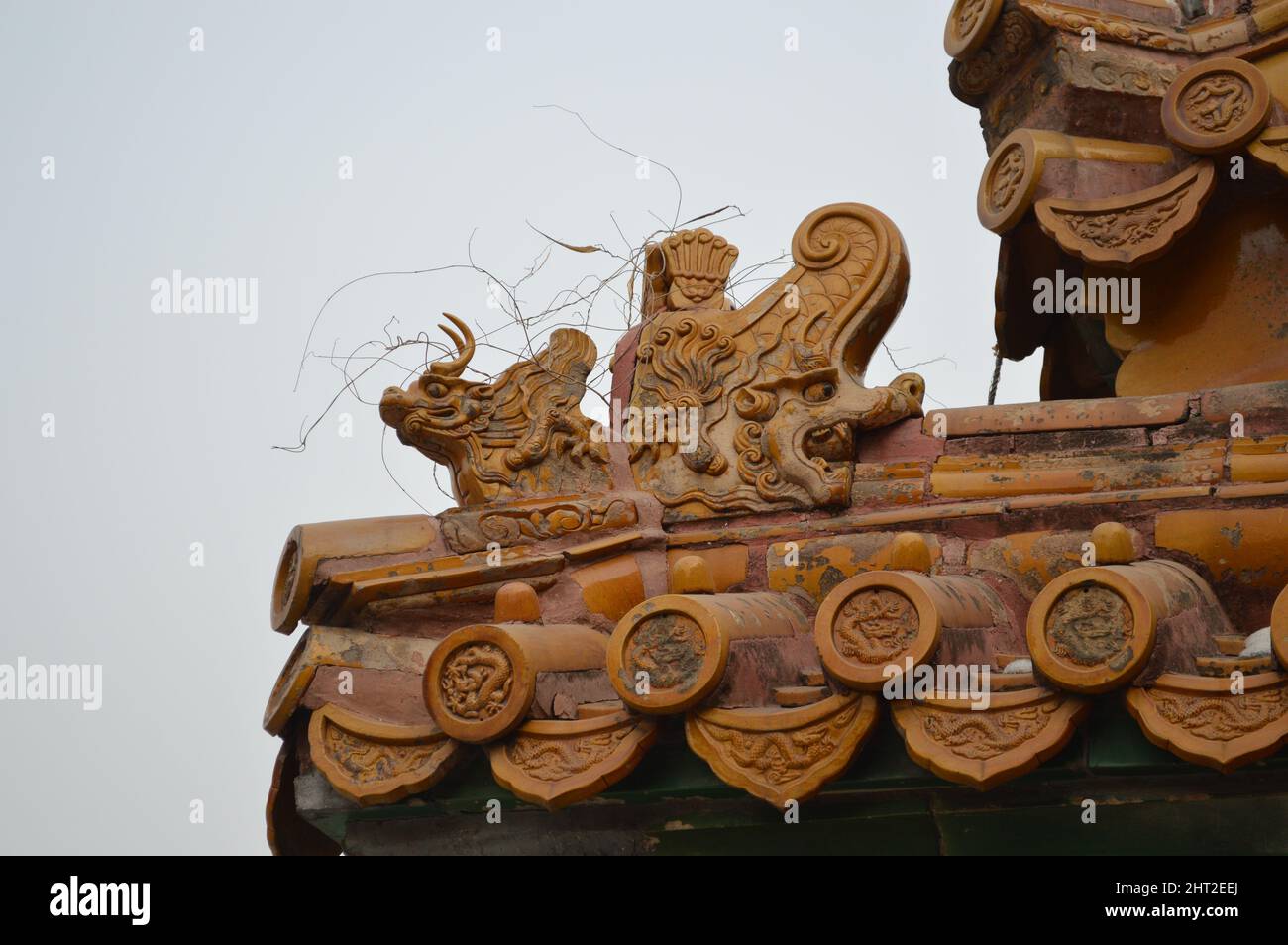Closeup of roof figures from The Forbidden City in Beijing against a ...