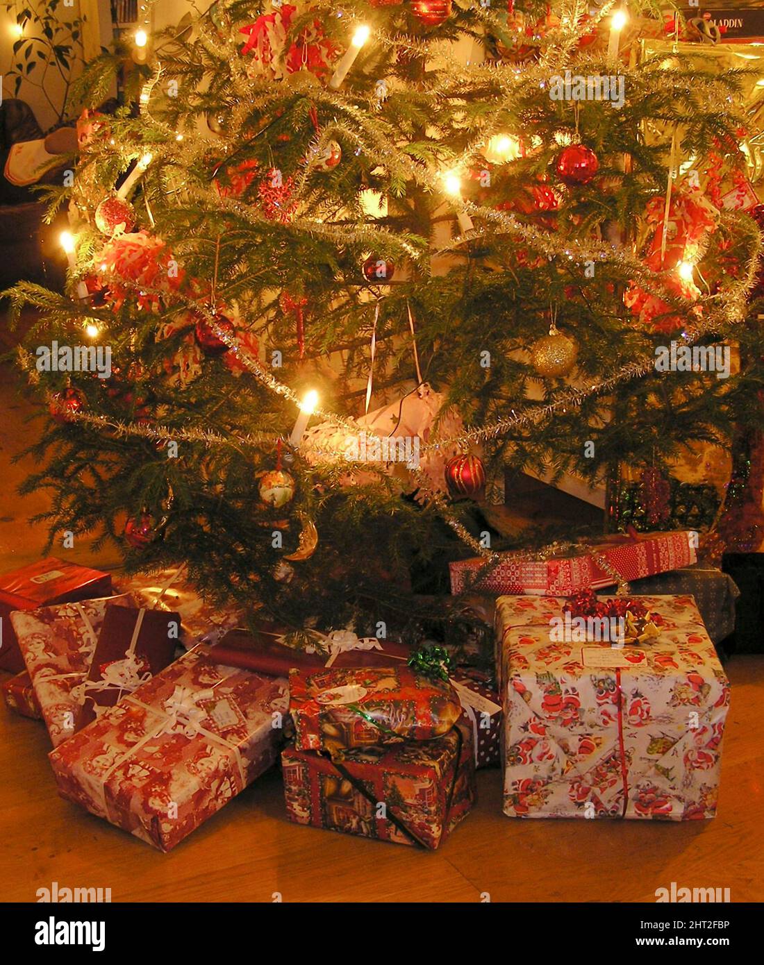Presents under Christmas tree Stock Photo - Alamy
