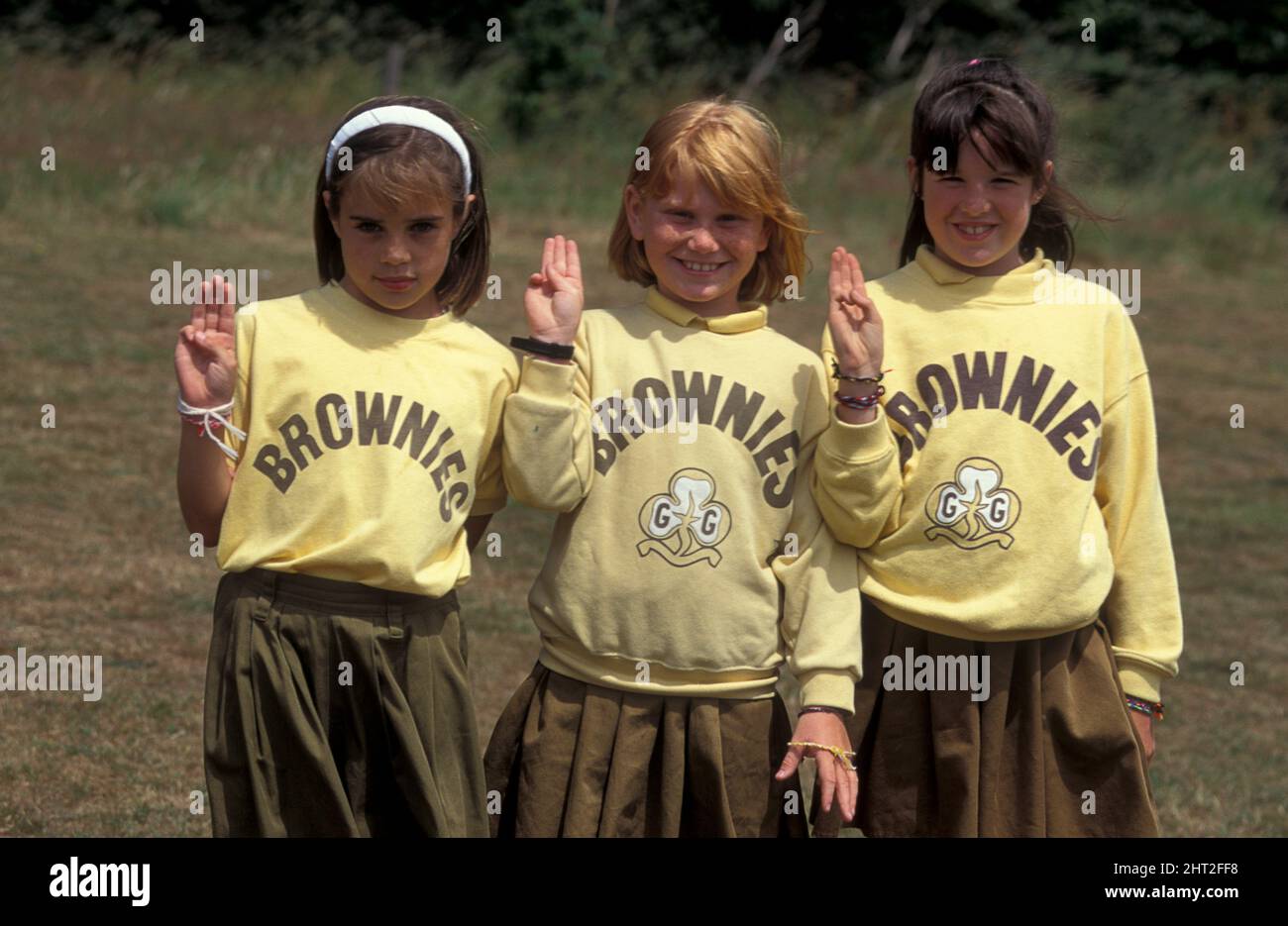 three millenium brownies in uniform showing the brownie promise sign ...