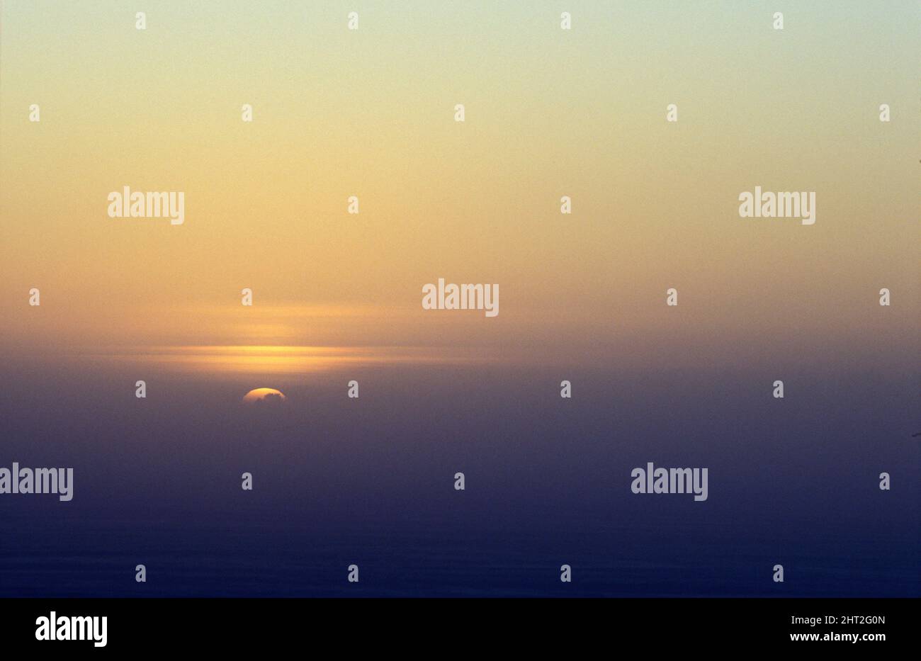 Foggy and misty evening, nightfall by the sea, analog. Just visible ...