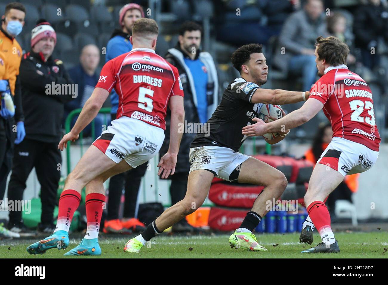 Darnell McIntosh (5) of Hull FC runs at Dan Sarginson (23) of Salford ...