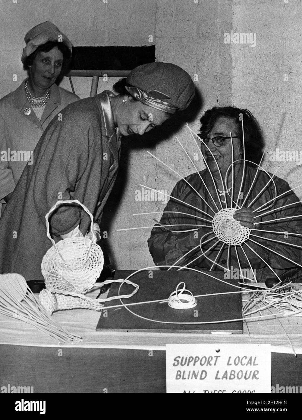 The Queen talks with Mrs Agnes Morris as she makes a basket at the ...