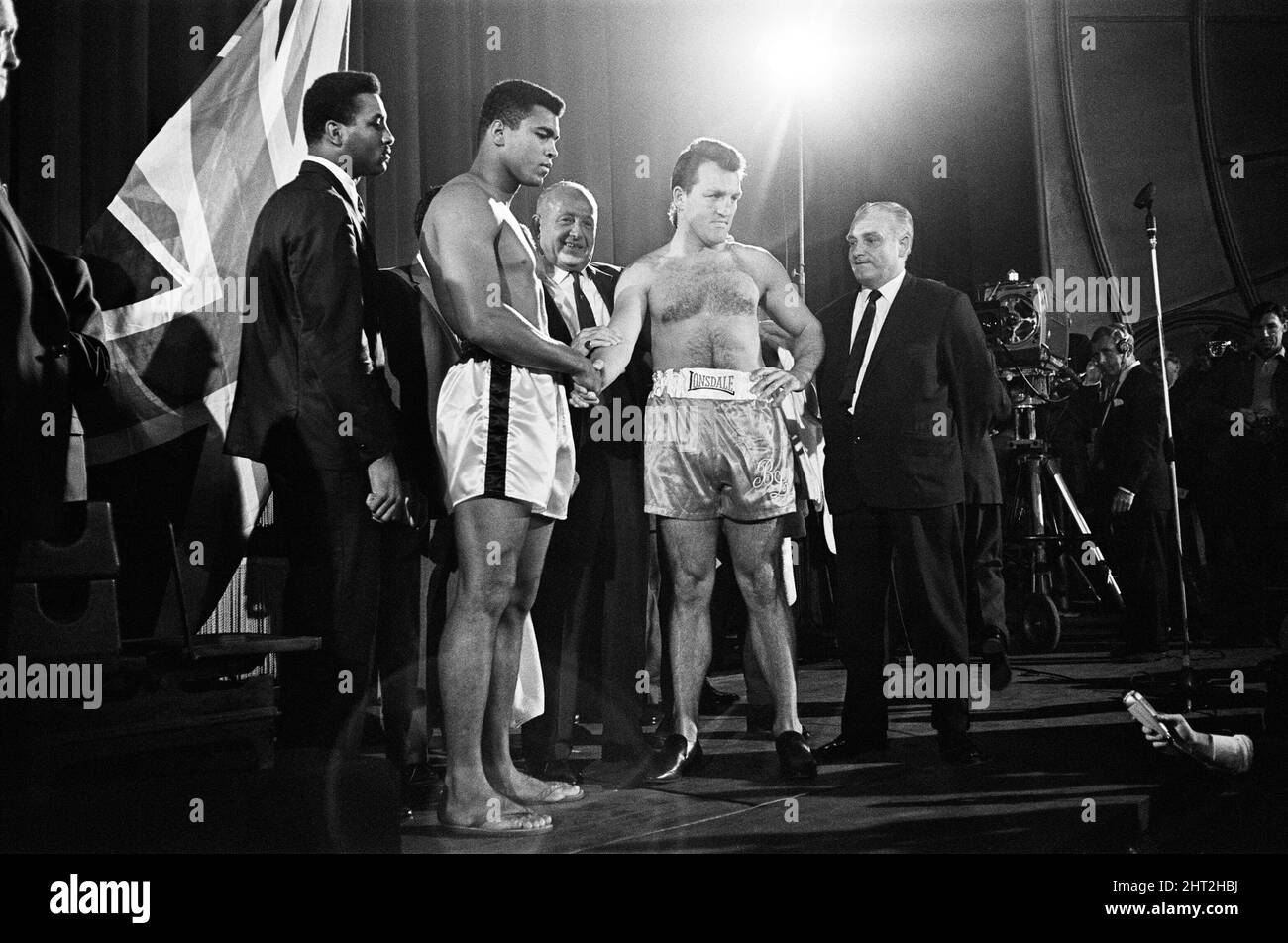 Muhammad Ali (left) and Brian London shake hands at the weigh-in ahead ...
