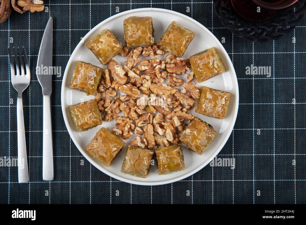 Traditional Turkish dessert walnut baklava with walnuts and tea on a ...