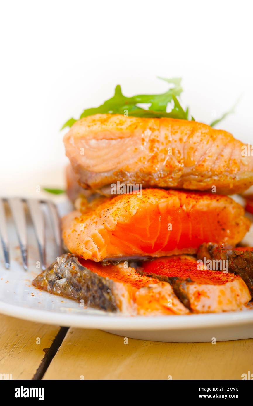 grilled fresh samon filet with vegetables salad tomato arugula ...