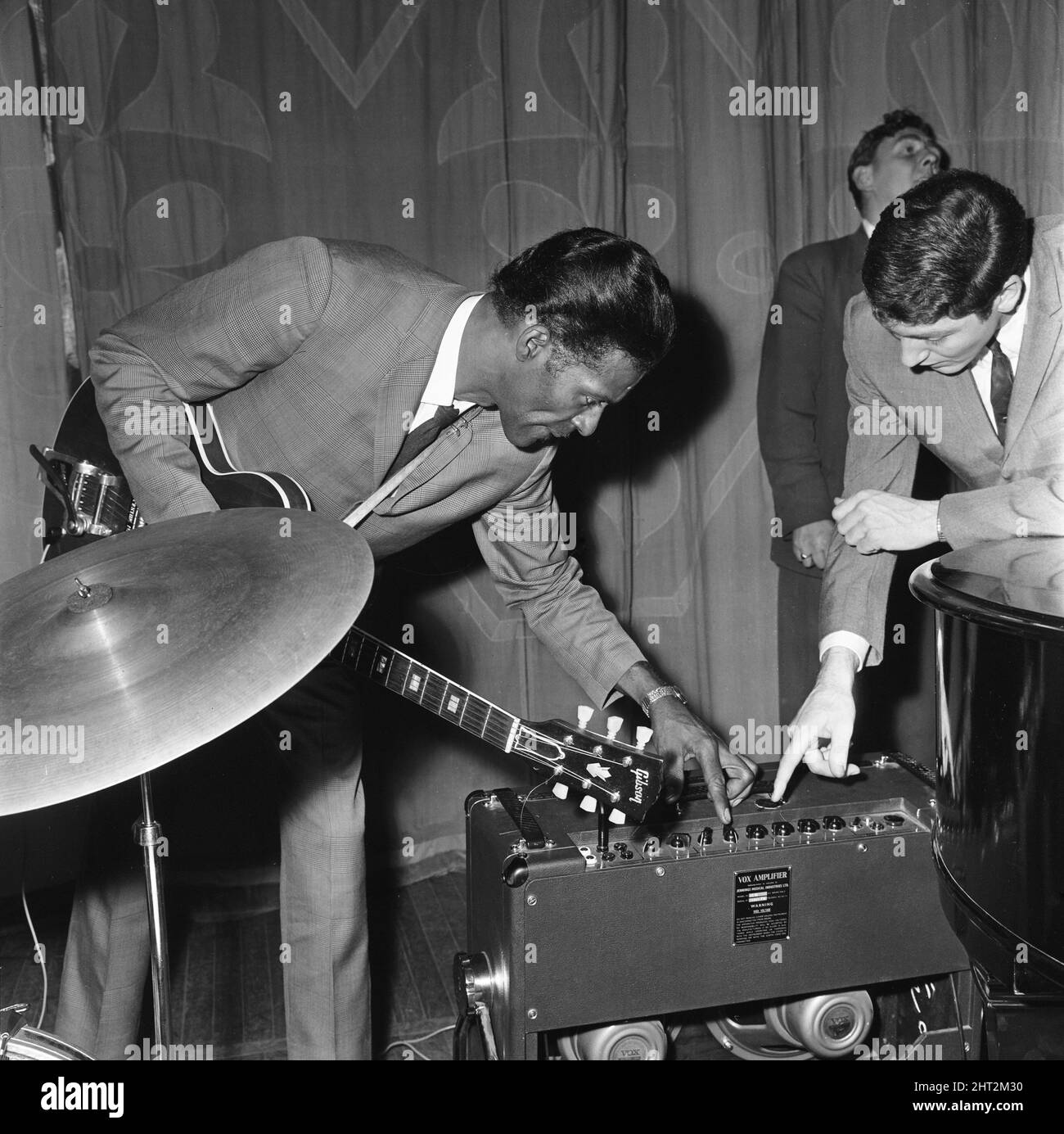 American rock and roll singer and musician Chuck Berry tunes up his ...