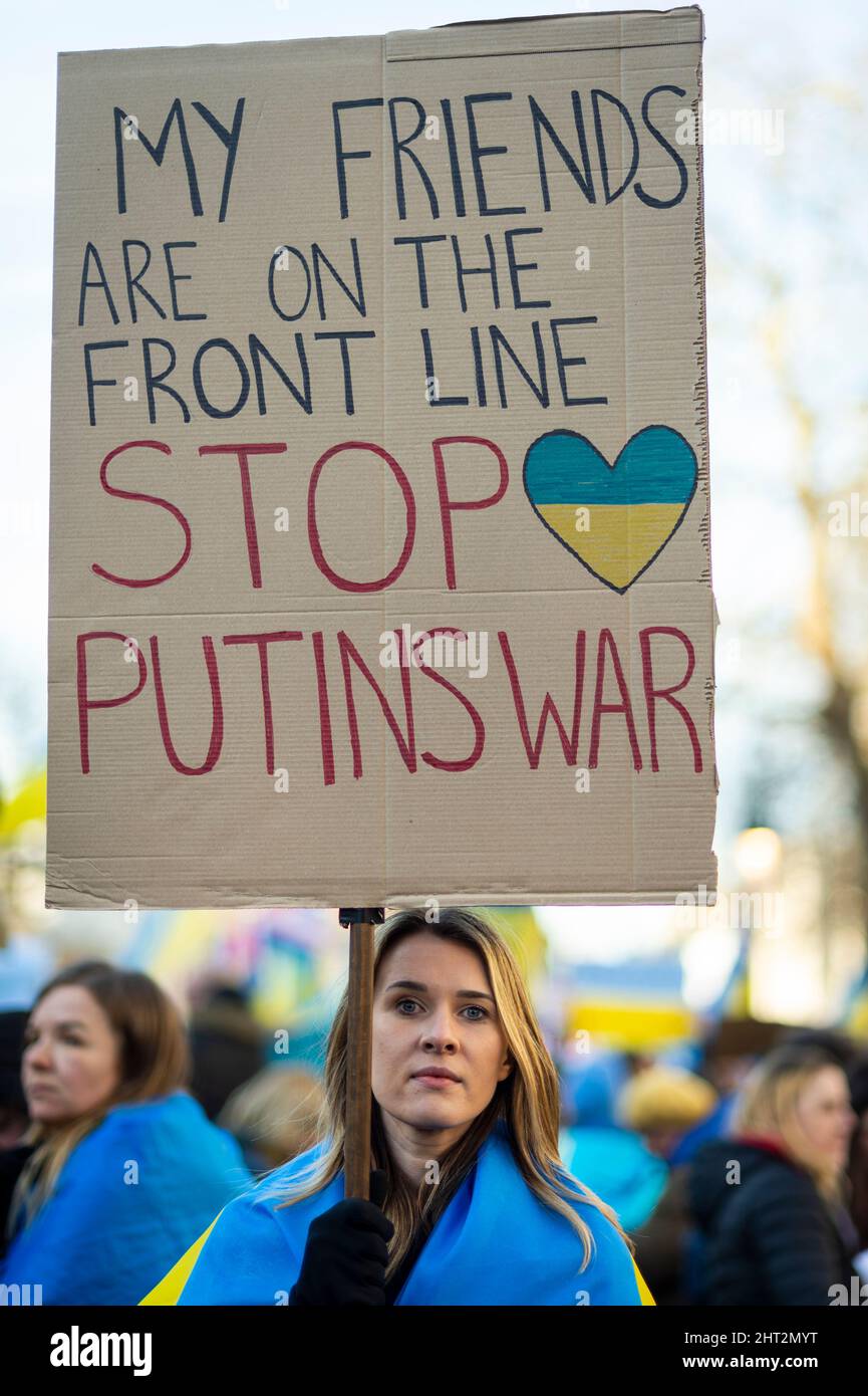 London, UK. 26 February 2022. A woman with a sign in during a protest ...