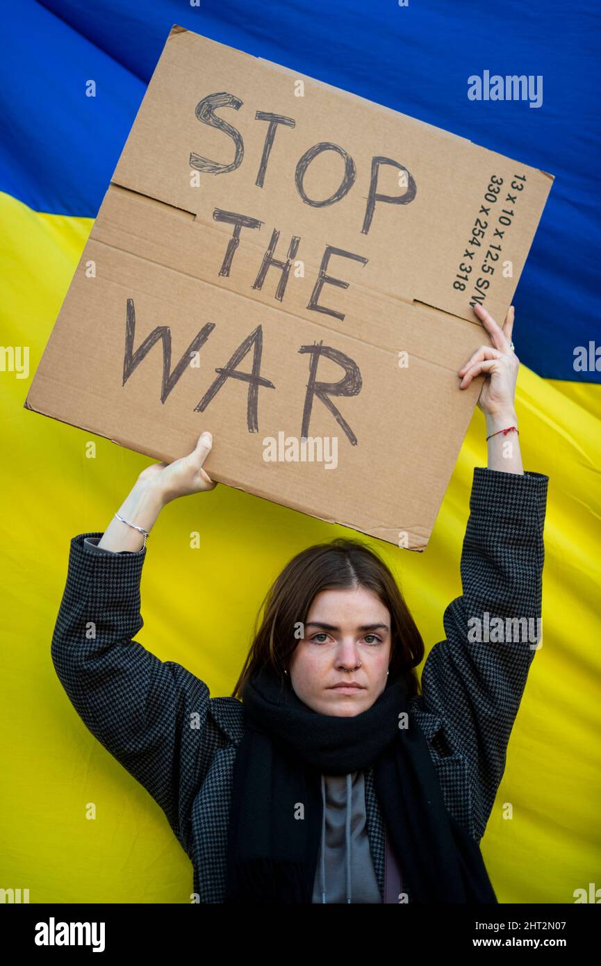 London, UK. 26 February 2022. A woman with a sign in front of a ...
