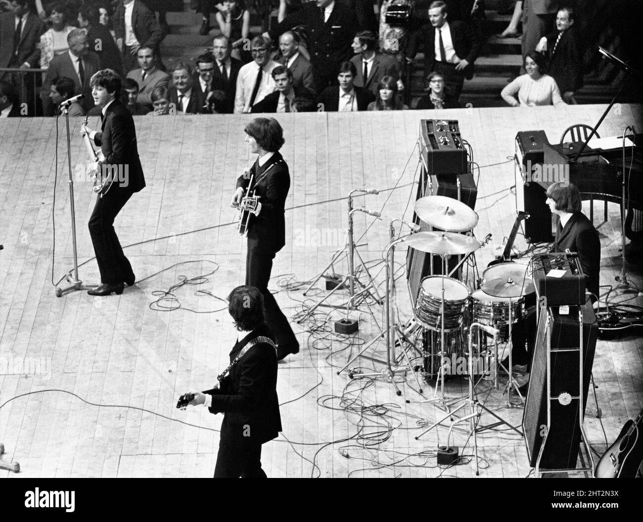 The Beatles on stage at the Palais des Sport in Paris. June 1965 Stock ...