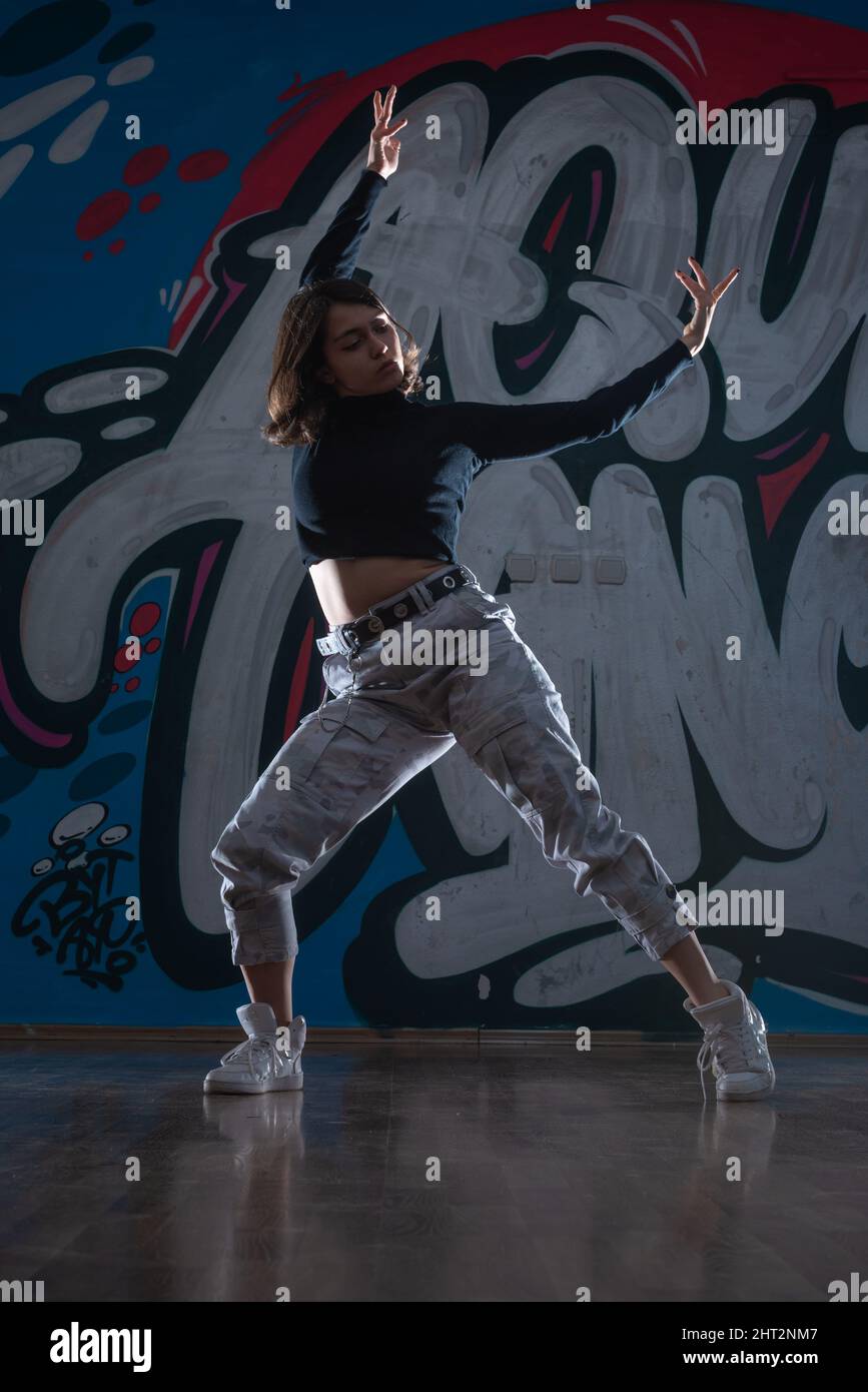 Silhouette of young woman hiphop dancer (breakdancer)dancing on ...