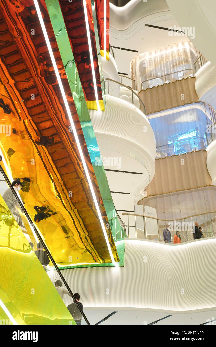 Low angle of a modern interior of a crowded building's stairs in ...
