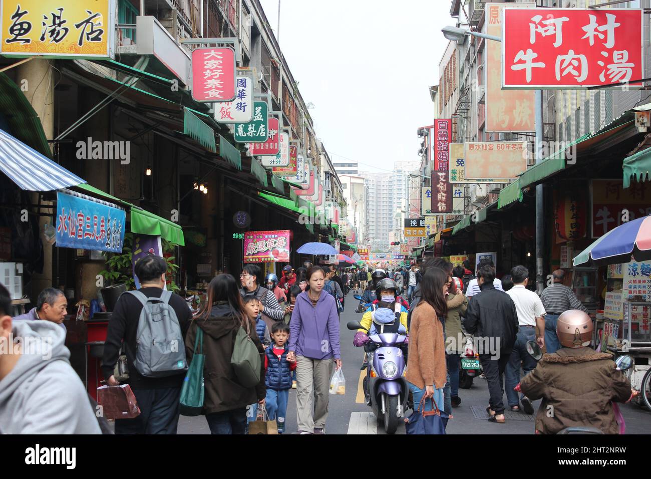 View of the Taiwan streets full of people casually walking between ...