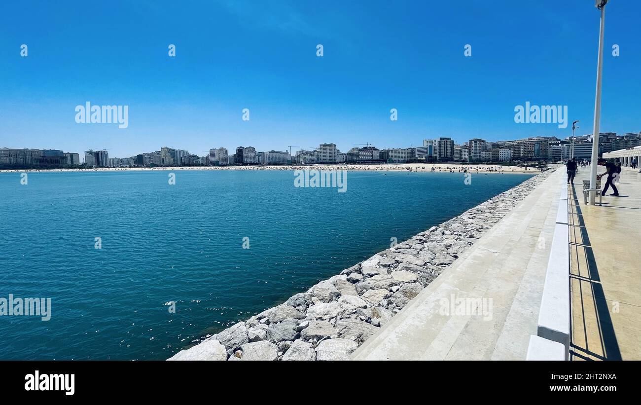 Beautiful view of the blue sea with the city in the background. Tanja ...