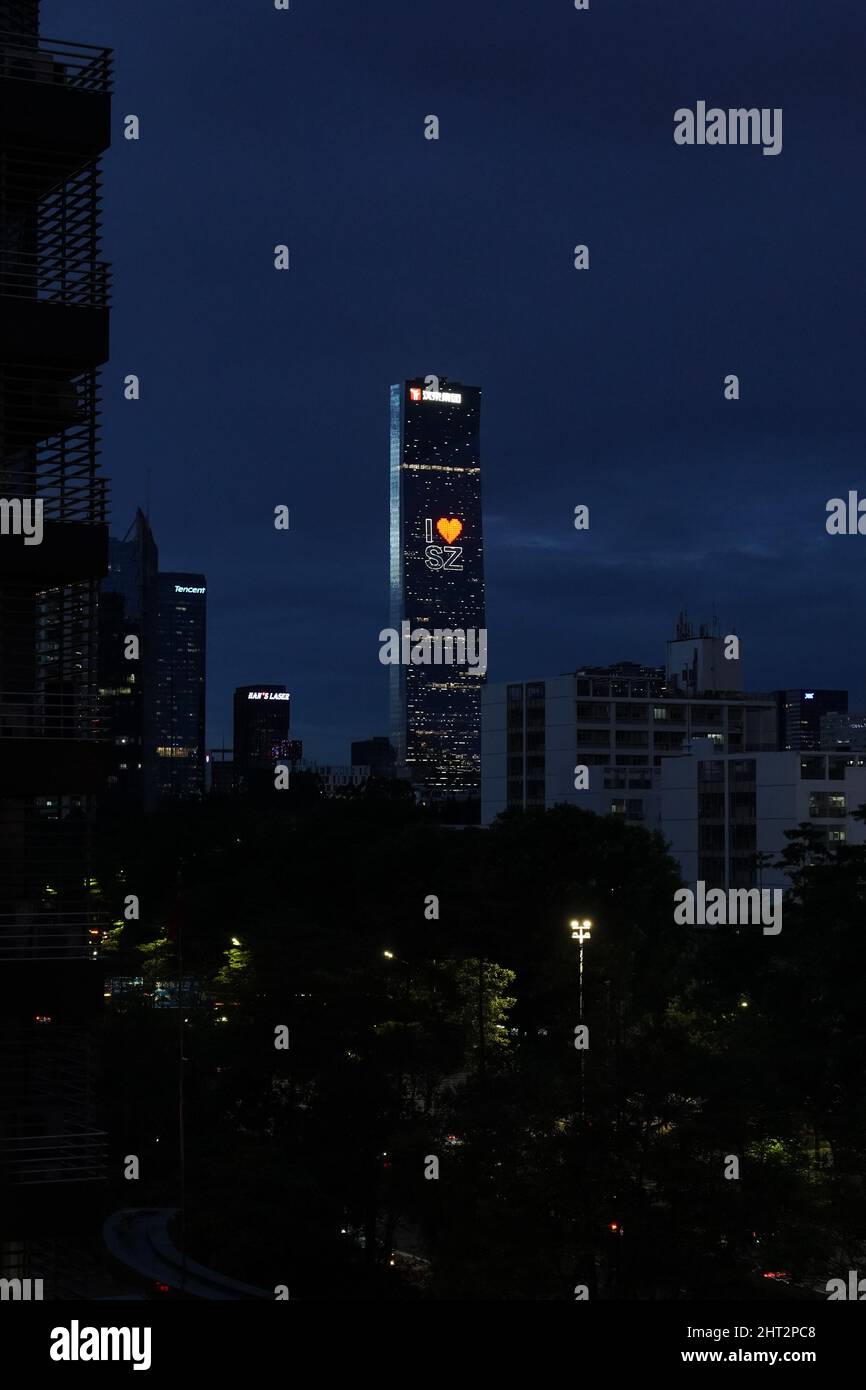 Vertical of a skyscraper illuminated with lettering "I love Shenzhen ...