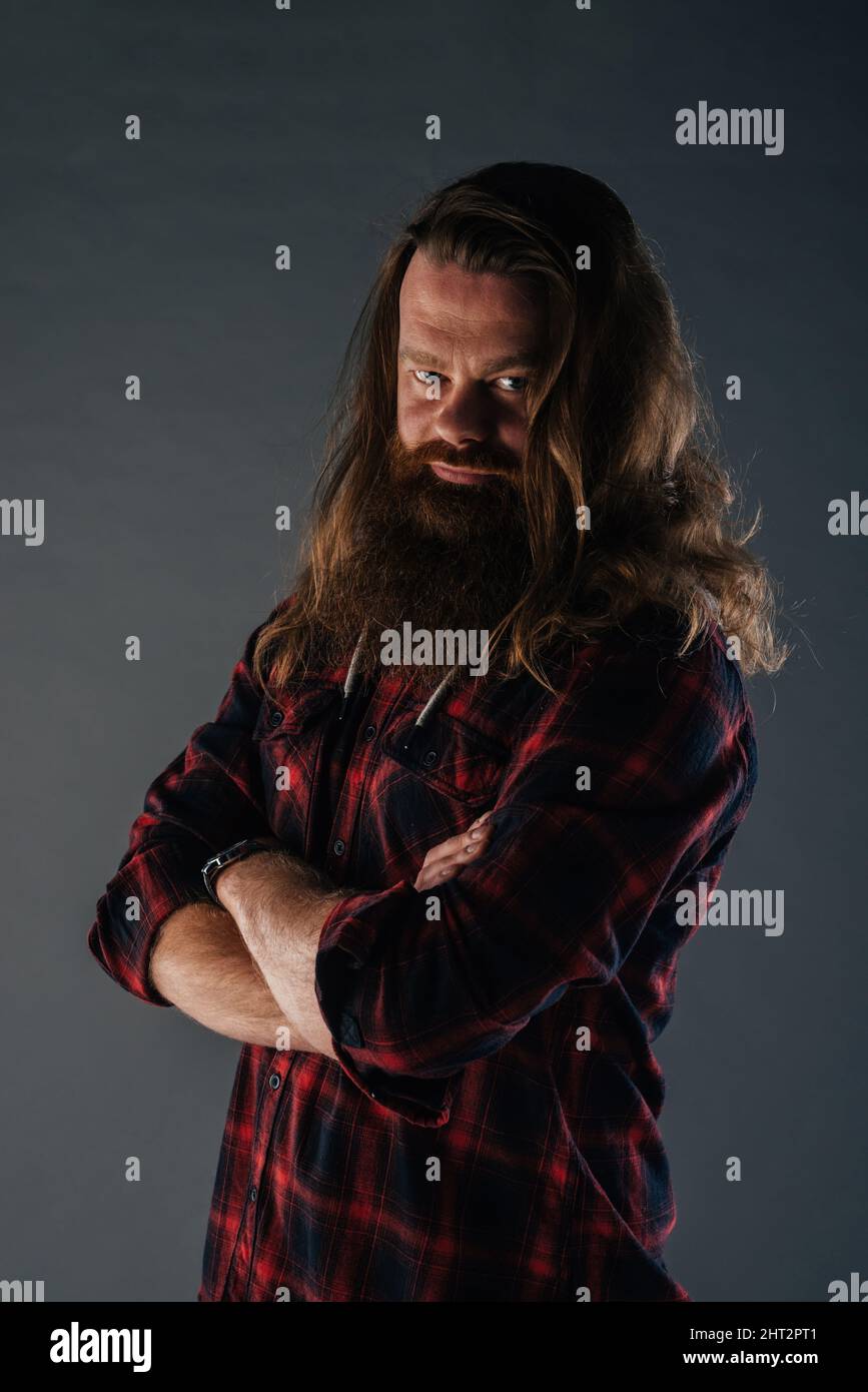 Beautiful strong nordic man with stylish hairstyle and beard on a ...