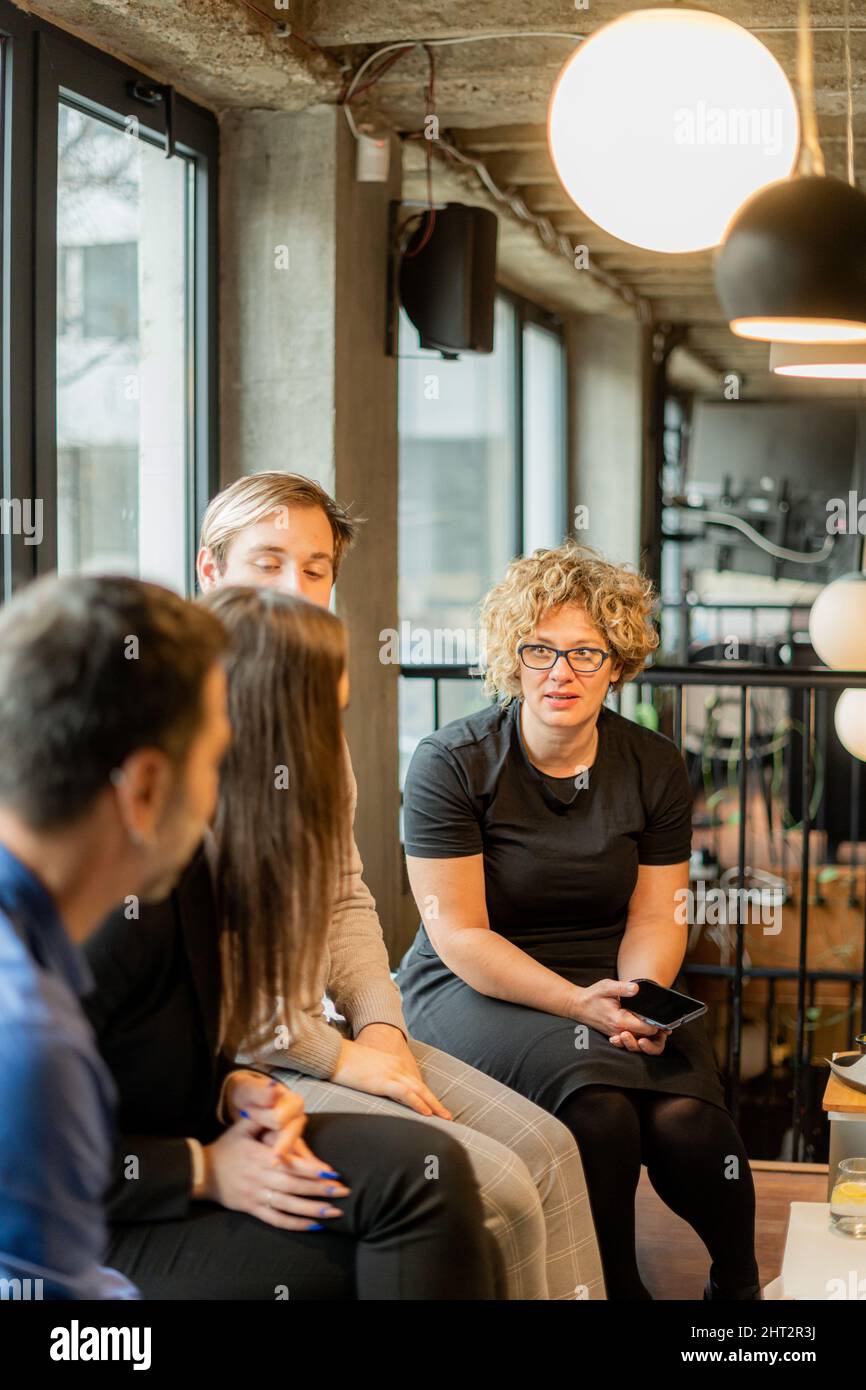 Group of amazing business people are having a serious talk Stock Photo ...