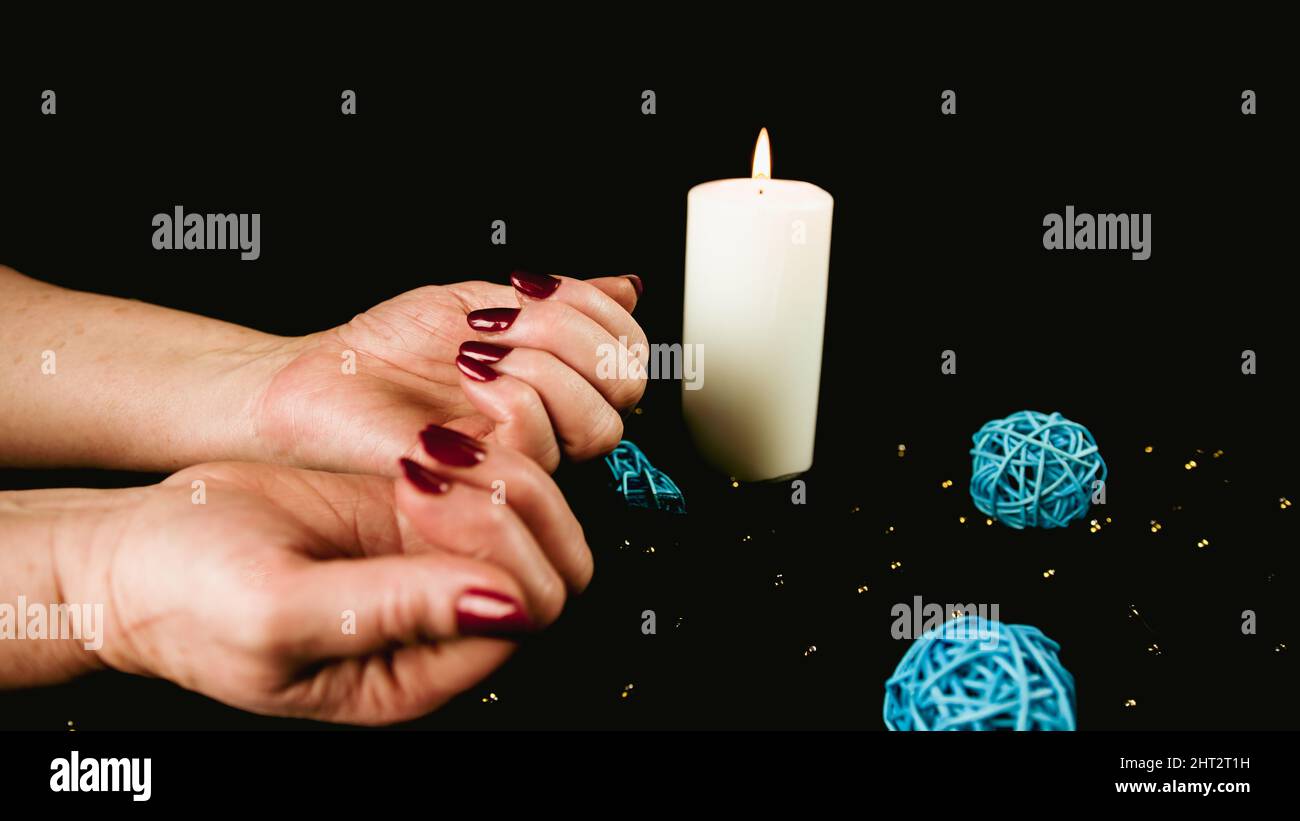 Crop woman with burning candle. Crop anonymous person demonstrating ...