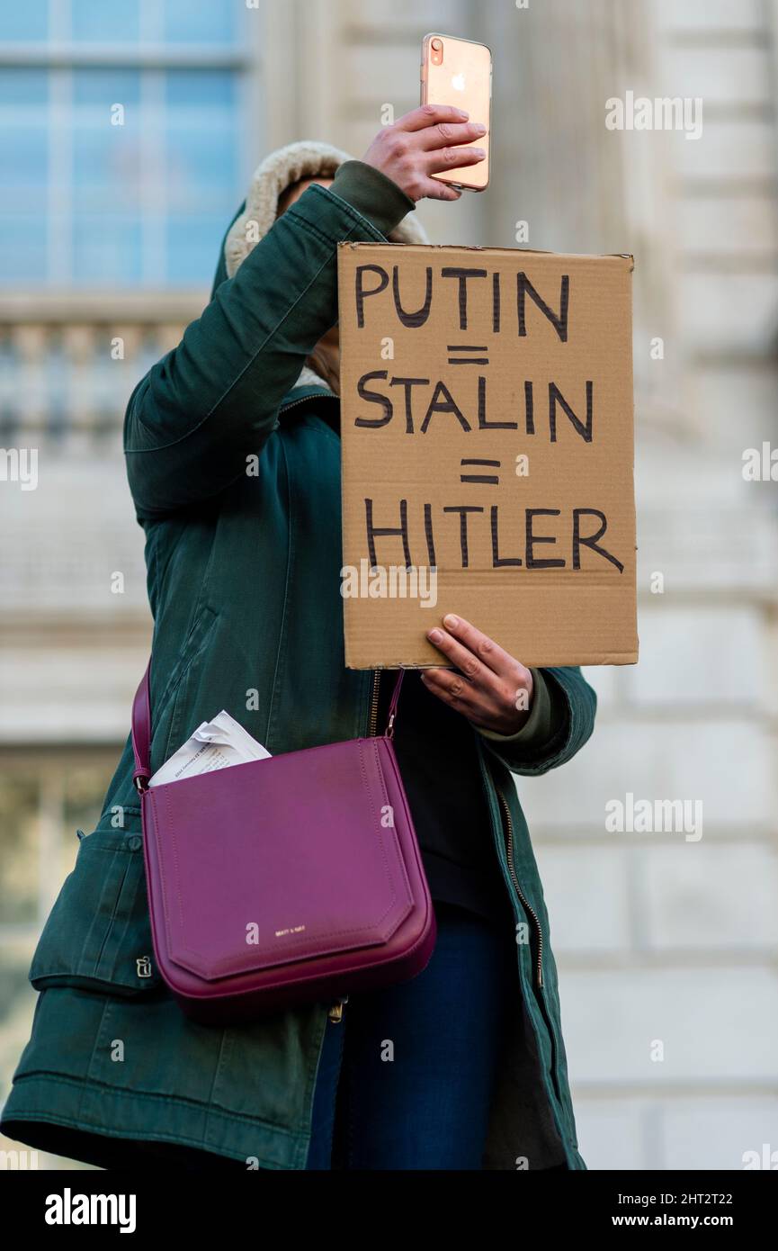 London, UK. 26 February 2022. A woman with a sign joins Ukrainians and ...