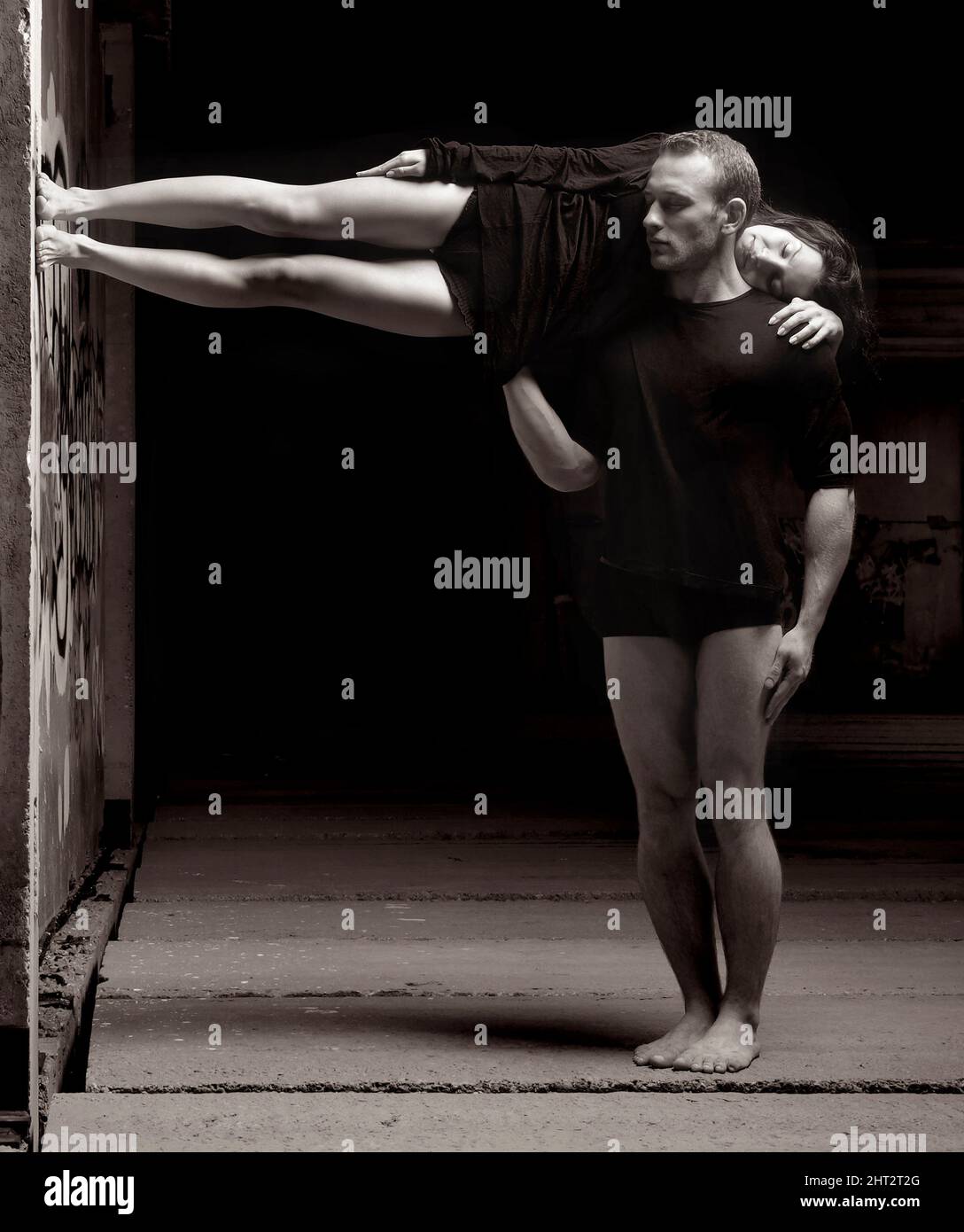 Body Frame. Two Dancers Forming a Body Frame Next to a Wall Stock Photo ...