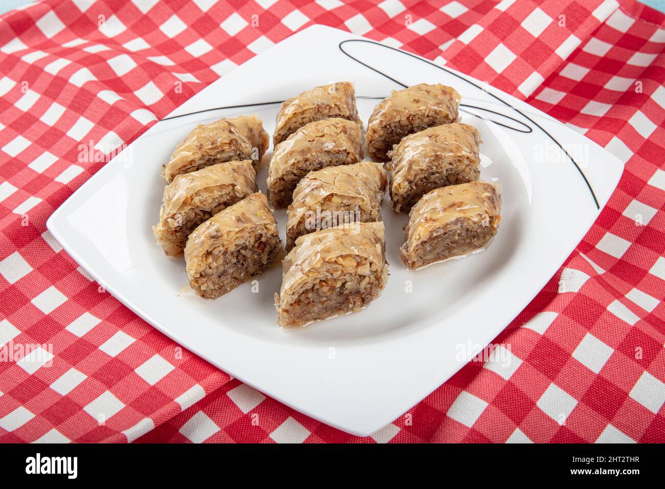 Traditional Turkish dessert walnut baklava with walnuts and tea on a ...