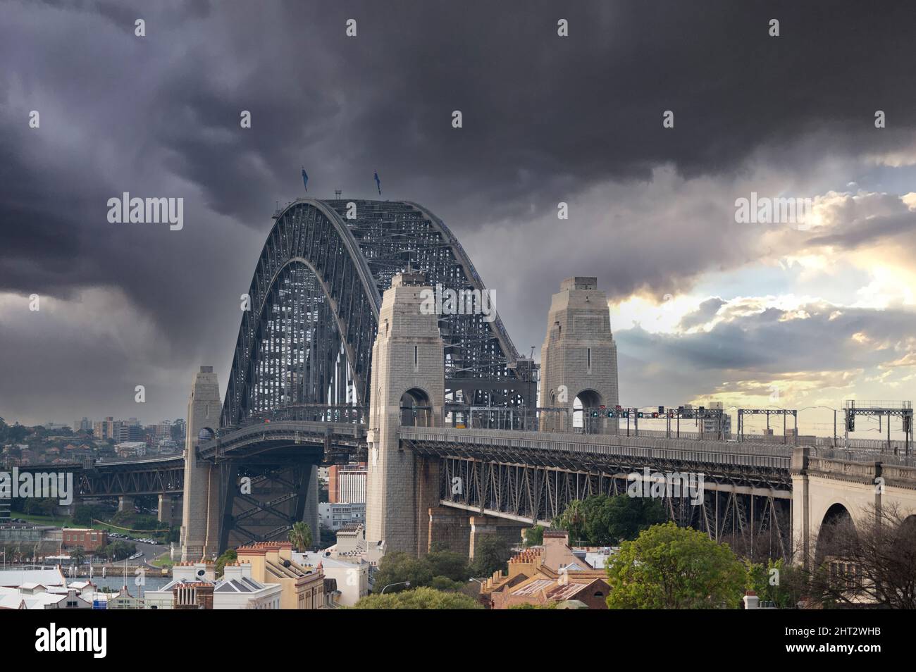 Breathtaking view of Sydney Harbour Bridge against a dark clouds ...