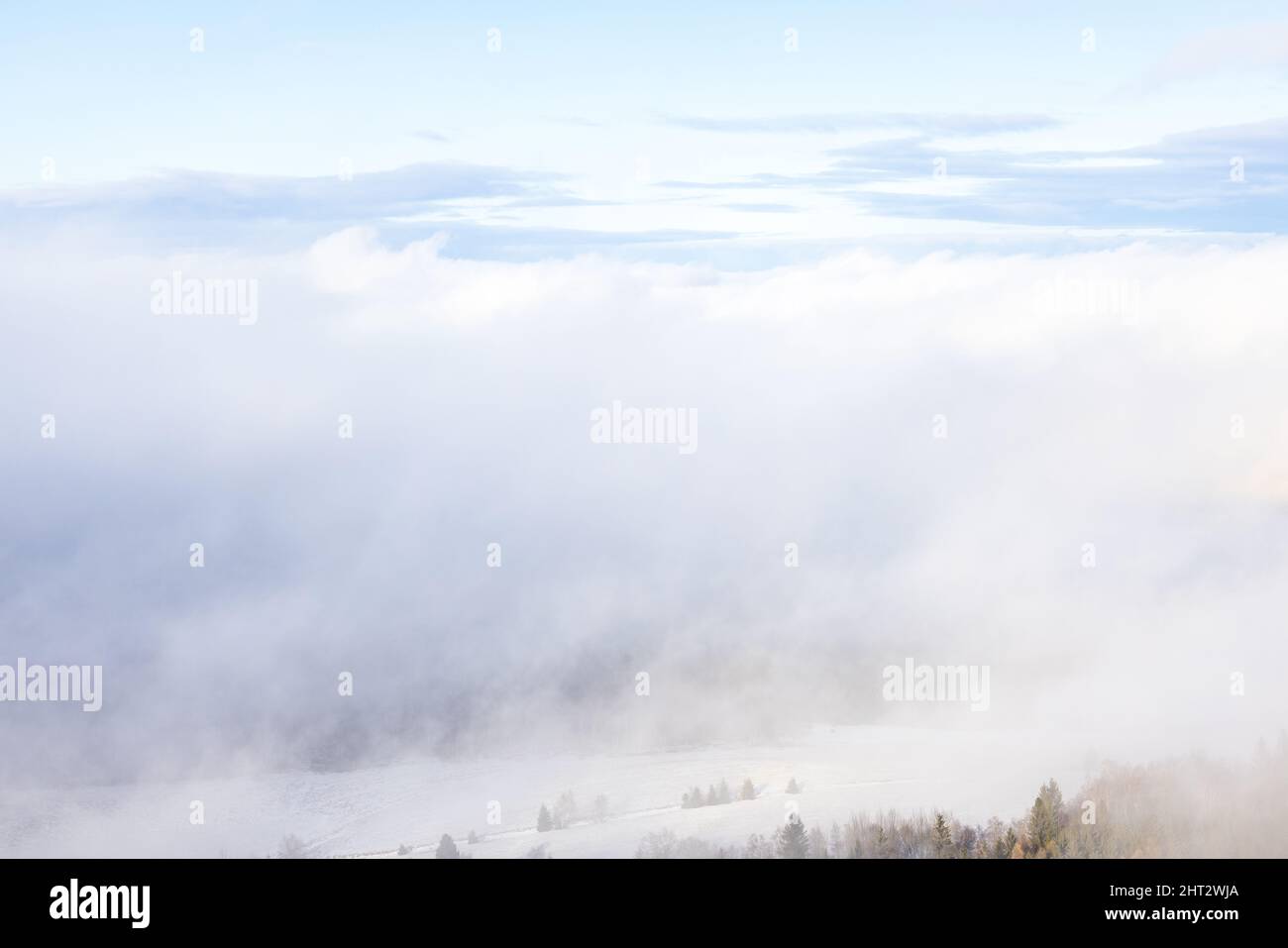 View of the foggy sky with clouds and mist during winter season Stock ...