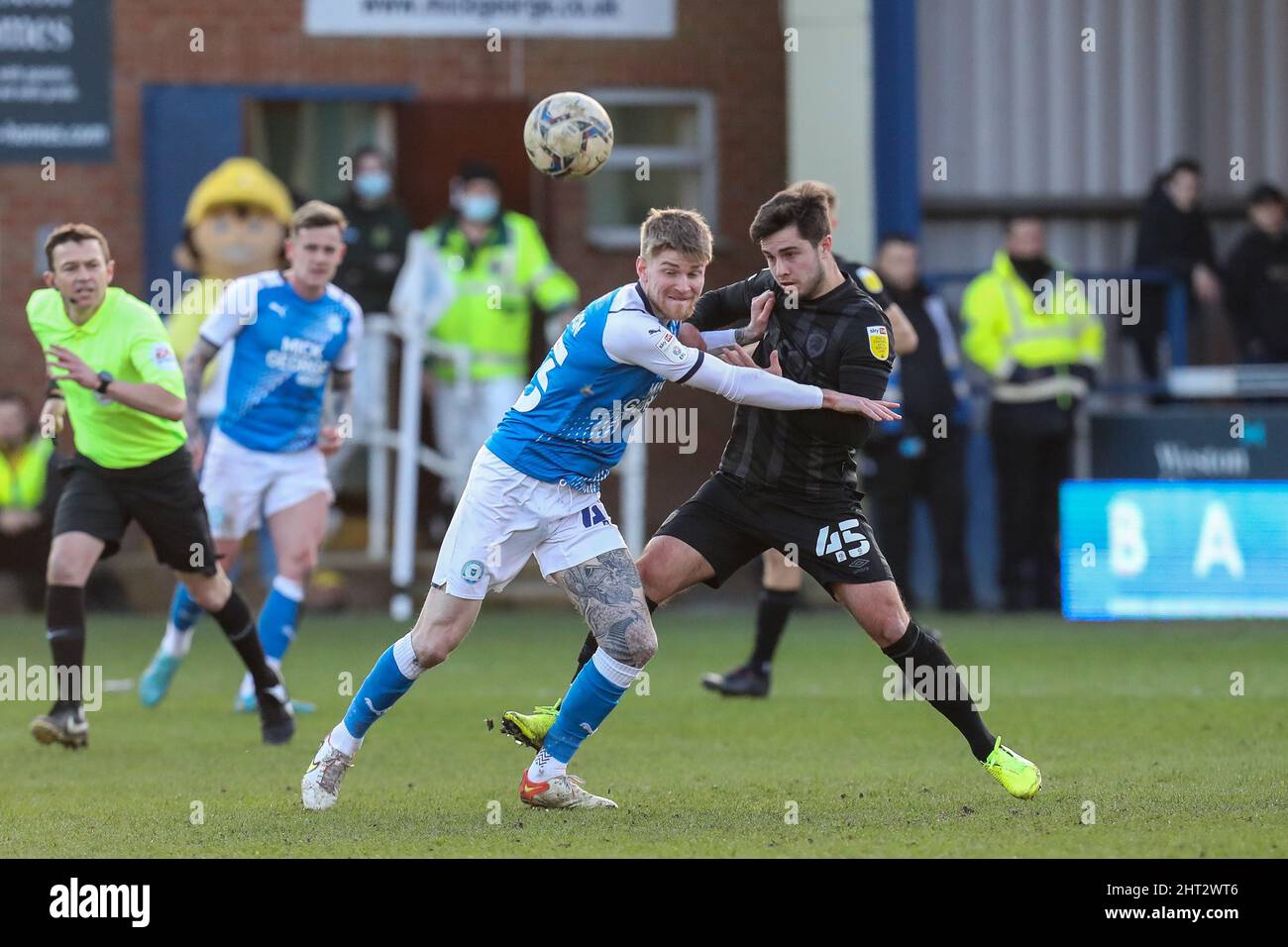 Hayden Coulson #43 of Peterborough United shields the ball from Liam ...