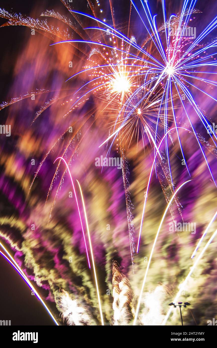 Abstract vertical background of colorful bright firework in the sky ...