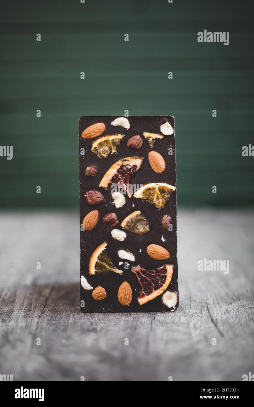 Vertical shot of a chocolate bar with nuts and dried fruit Stock Photo ...