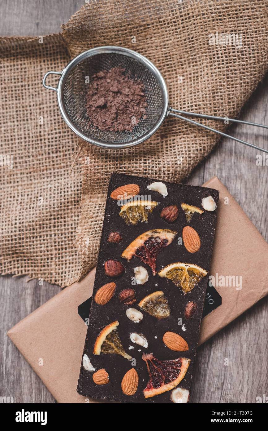 Vertical shot of a chocolate bar with nuts and dried fruit Stock Photo ...