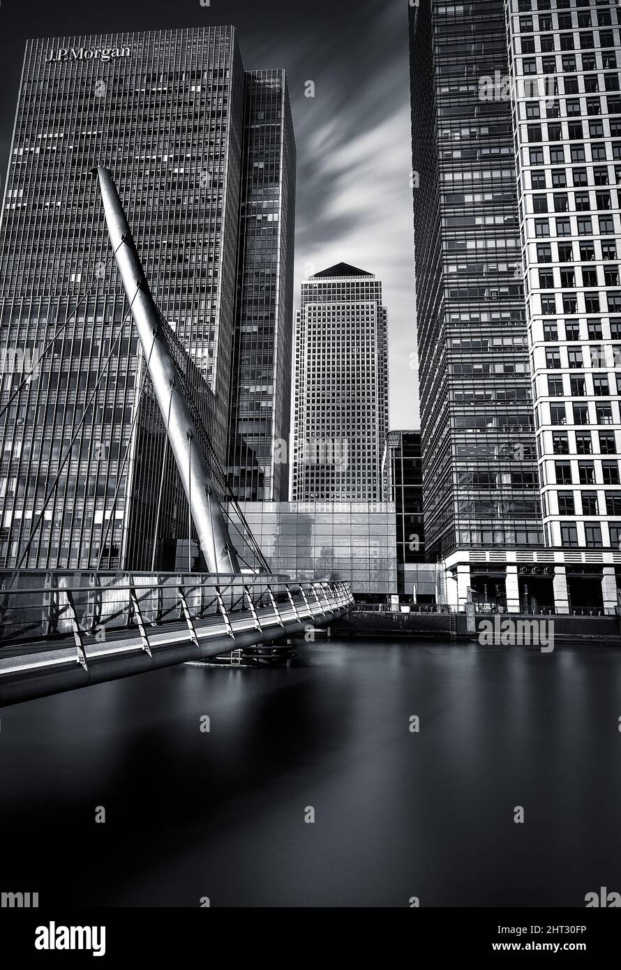 Vertical, grayscale shot of a bridge on a river in London, UK Stock ...