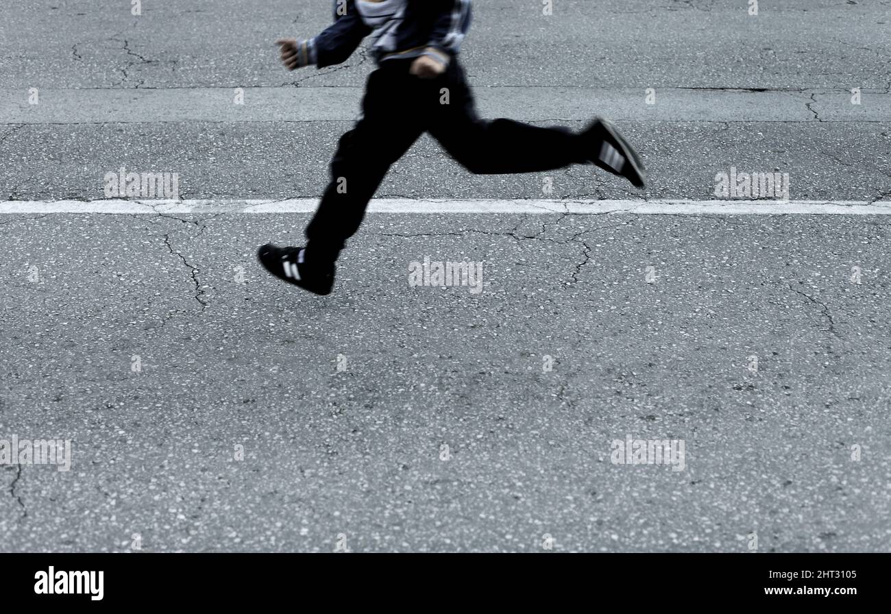 Man in black tracksuit running hi-res stock photography and images - Alamy