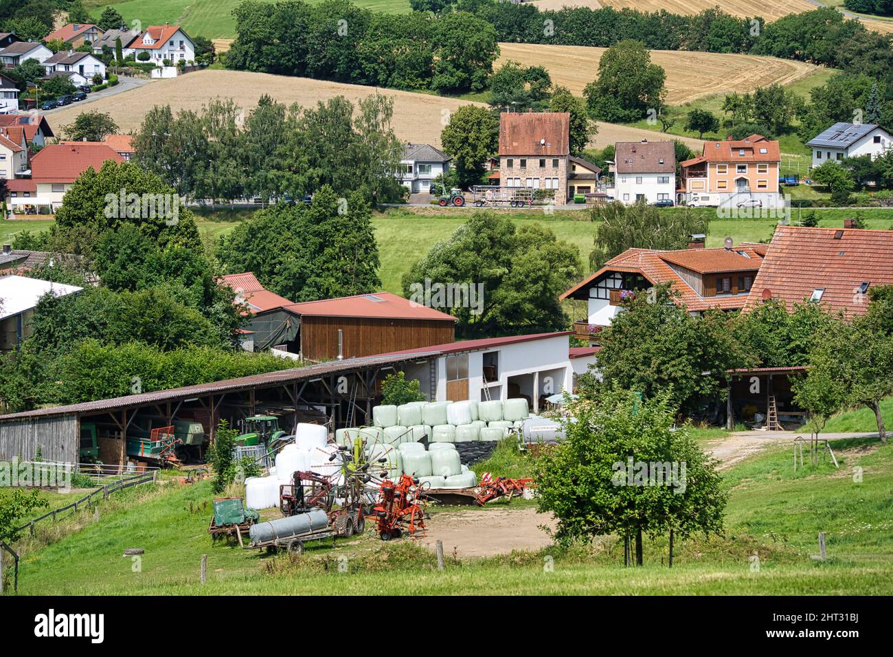 Picture of a farm with a village Stock Photo - Alamy