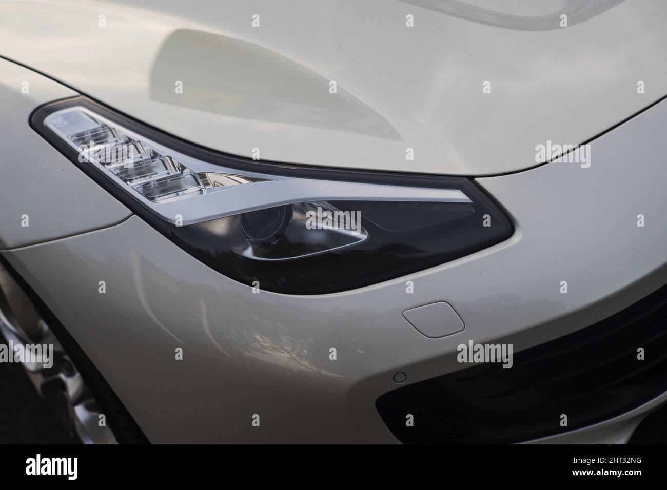 Closeup sot of a luxury white car headlight Stock Photo - Alamy